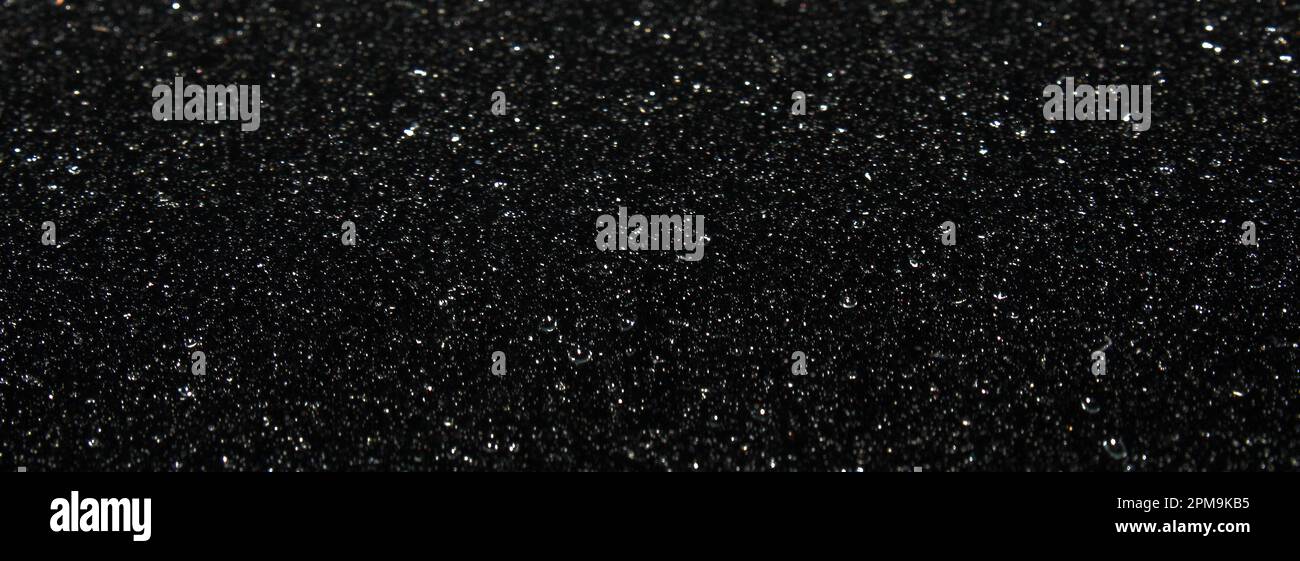 rain drops on a glass with a black background Stock Photo - Alamy