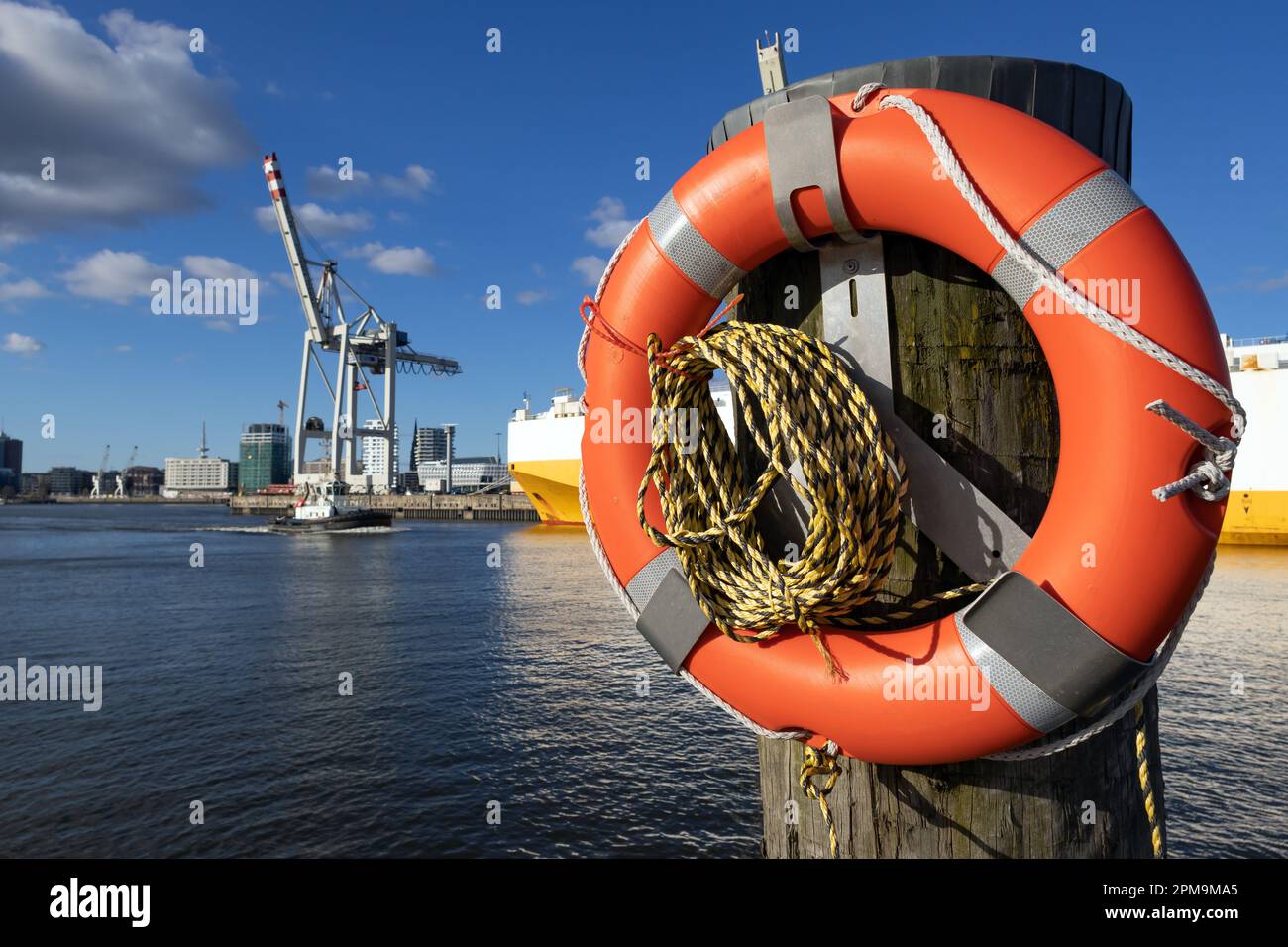 lifebelt with line in the port of hamburg Stock Photo - Alamy