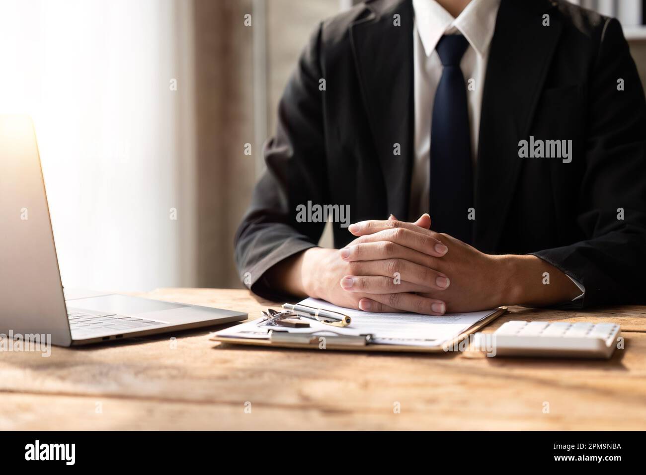 Bank loan workers are using calculators to calculate home loan interest ...