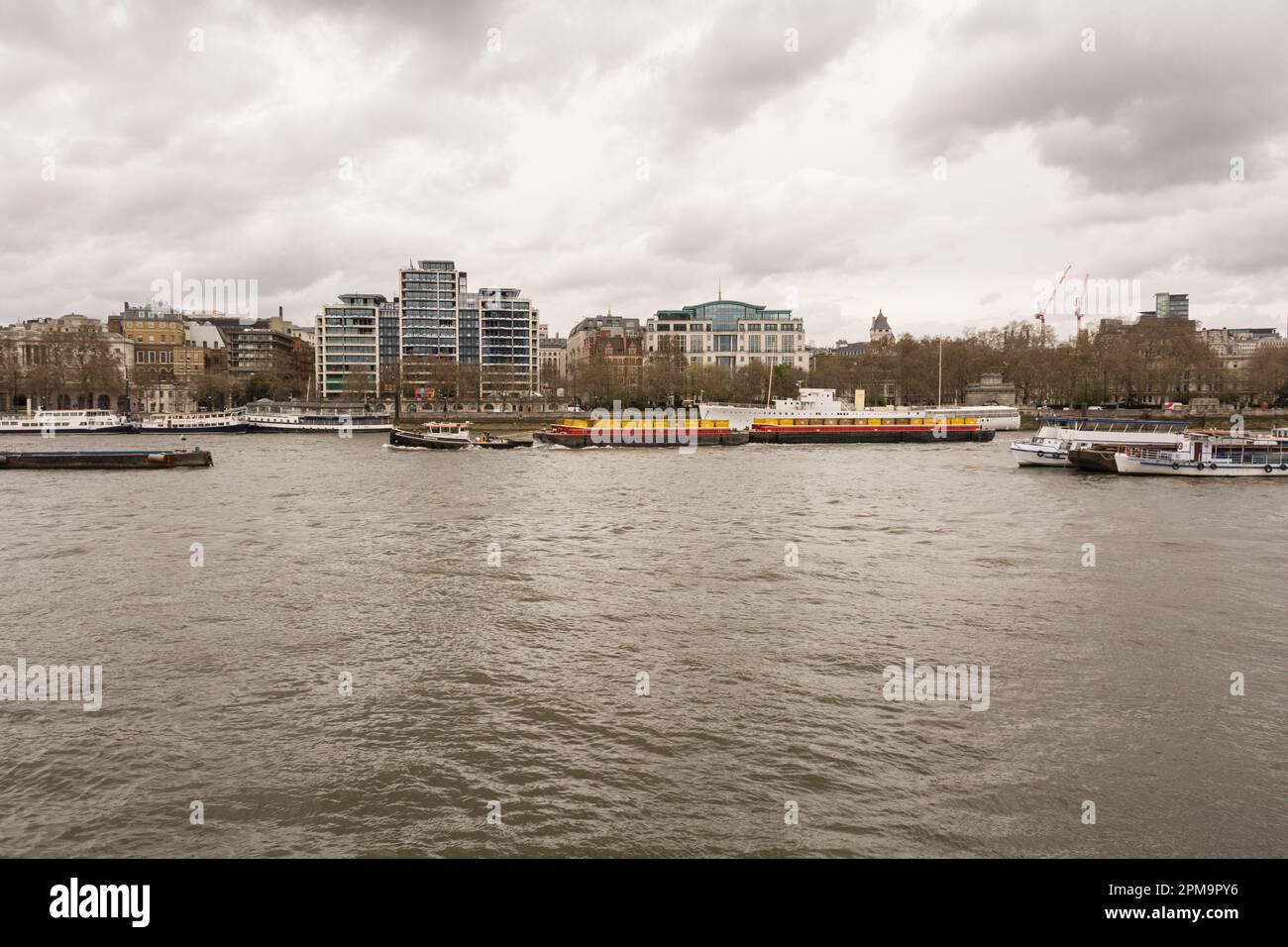 Redoubt, a Thames tugboat pulling Cory container barges down the River ...
