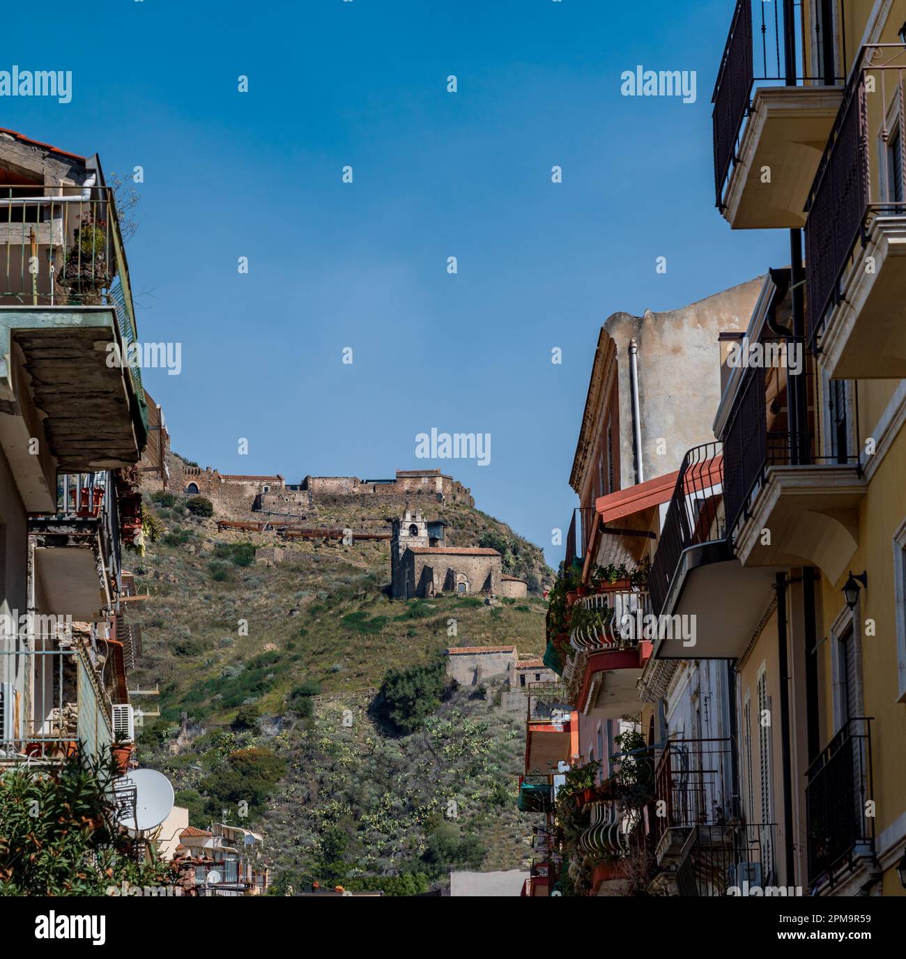 the arabonormanno castle in Calatabiano dominates the main street of ...