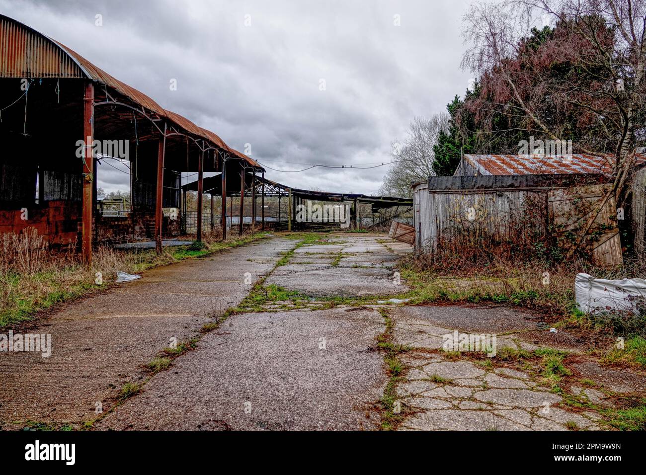 An abandoned, run down and derelict farmyard and buildings Stock Photo ...