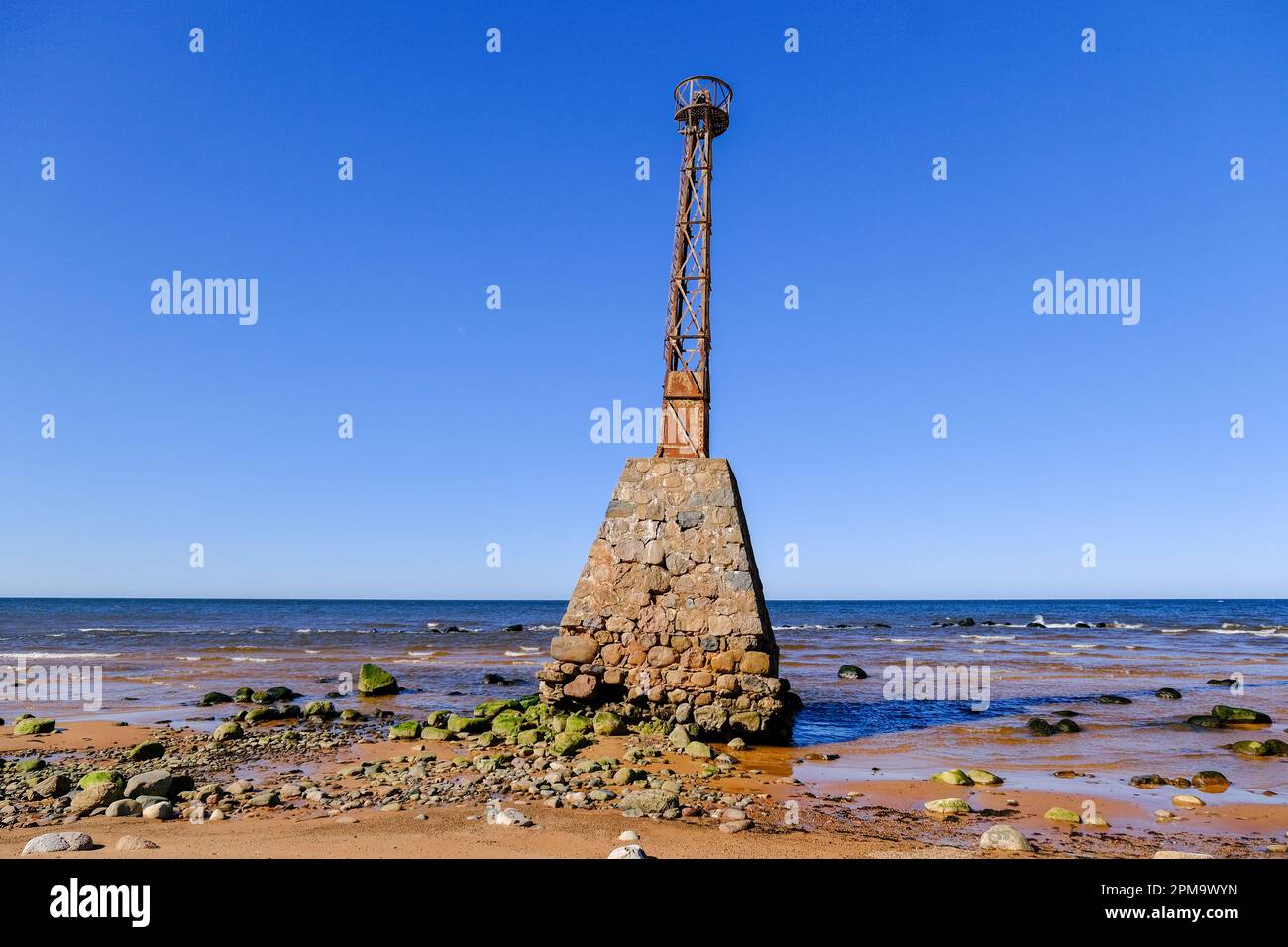 Ruins of the ancient Kurmrags lighthouse on the shore of the Gulf of ...