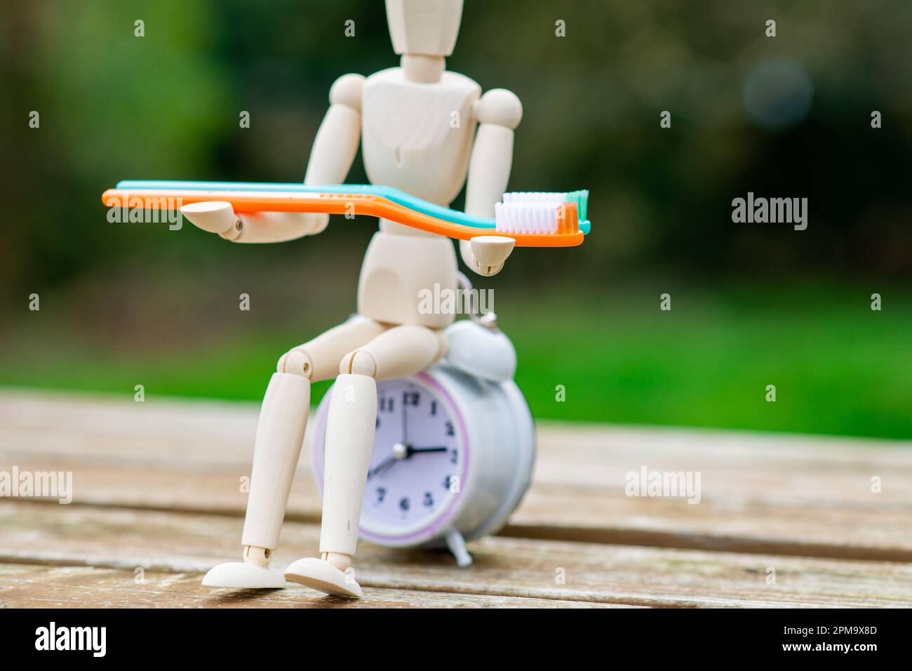 time to brush your teeth concept. Toothbrush in the hands of a human ...