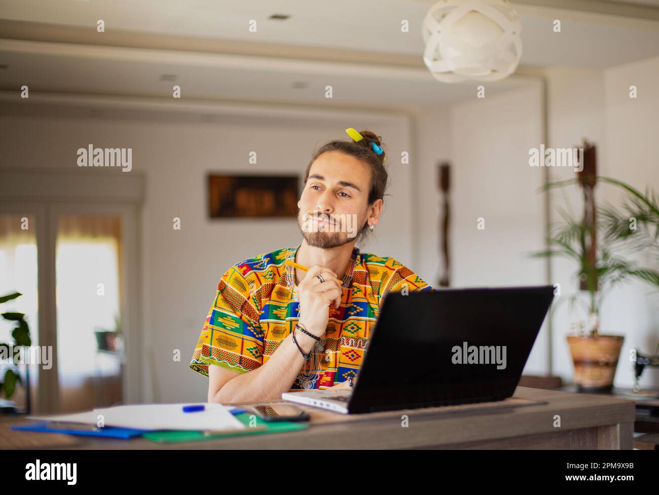 Long hair student work from home Stock Photo - Alamy
