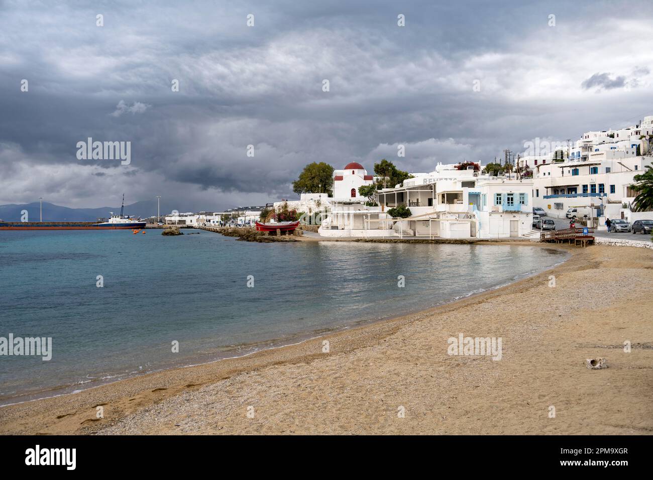 Paralia Choras Mikonou beach, white Cycladic houses of Mykonos town ...