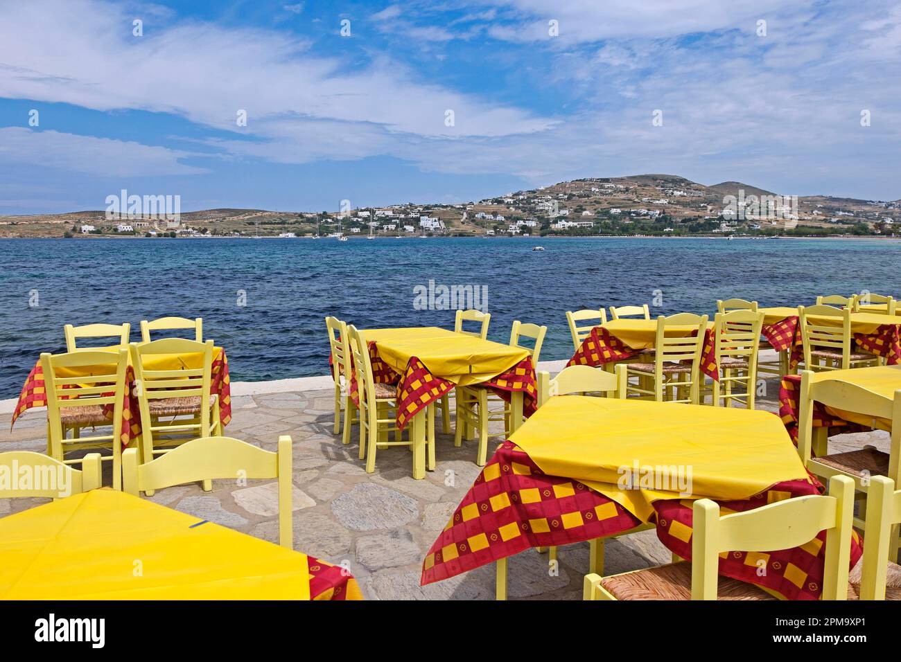 Tables in a restaurant by the sea in Parikia, Paros Island, Cyclades ...