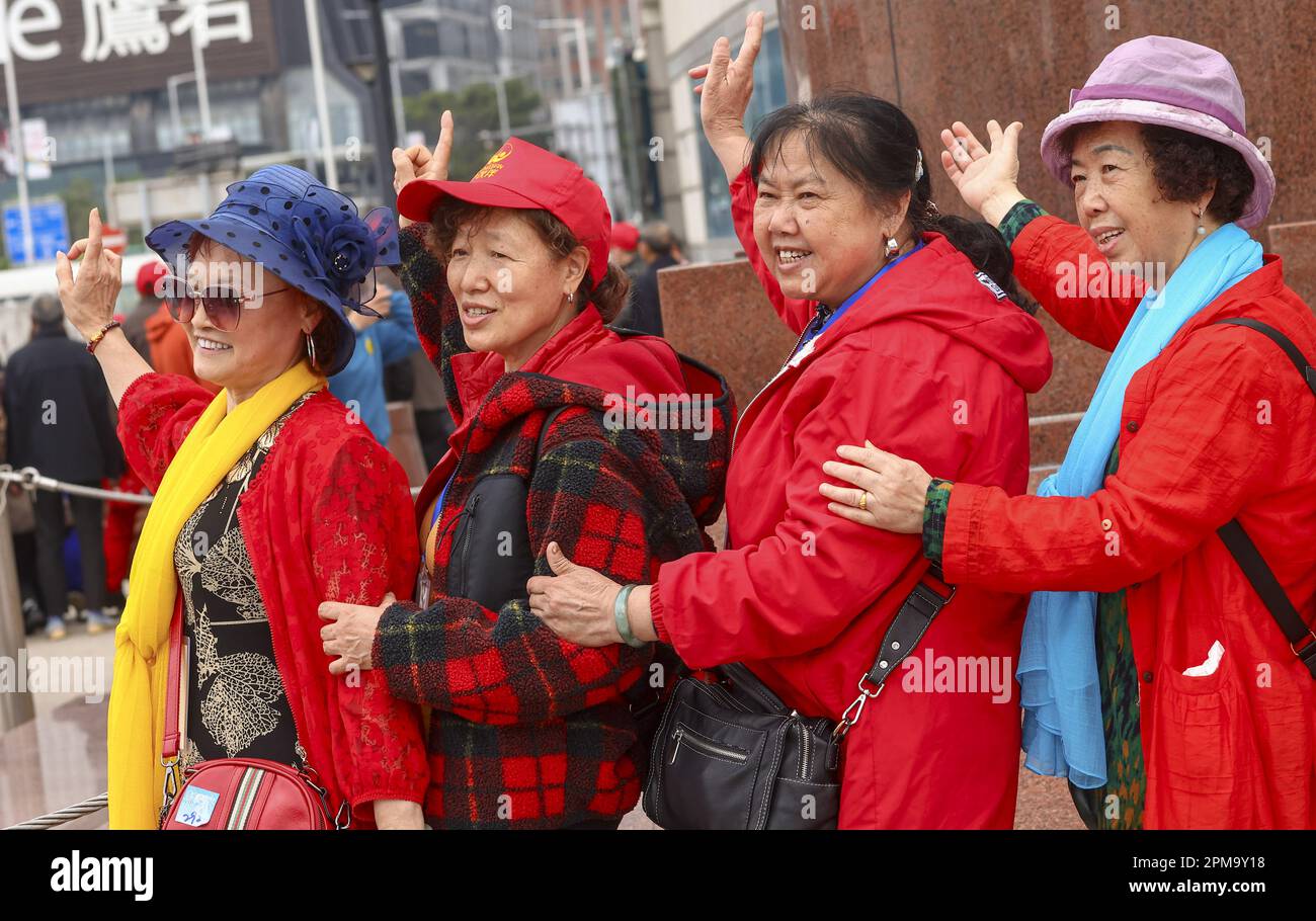 Mainland tourists posing for pictures at Golden Bauhinia Square, Wan ...