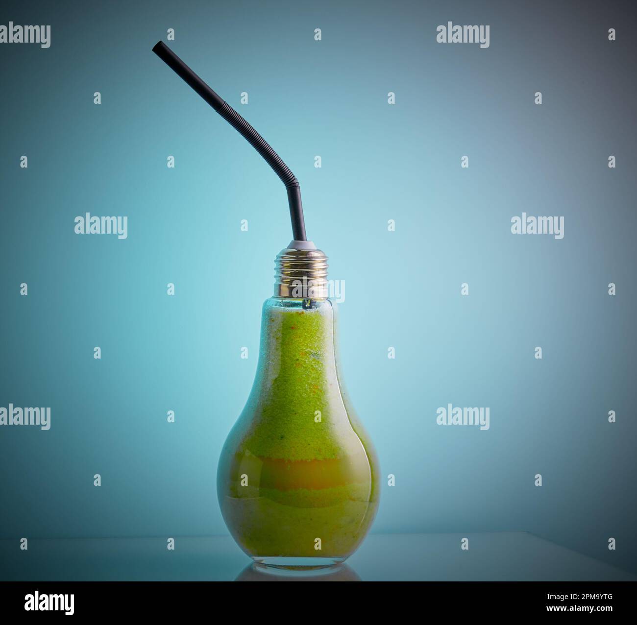 Cocktail,smoothie drink in light bulb shaped bottle with straw isolated ...