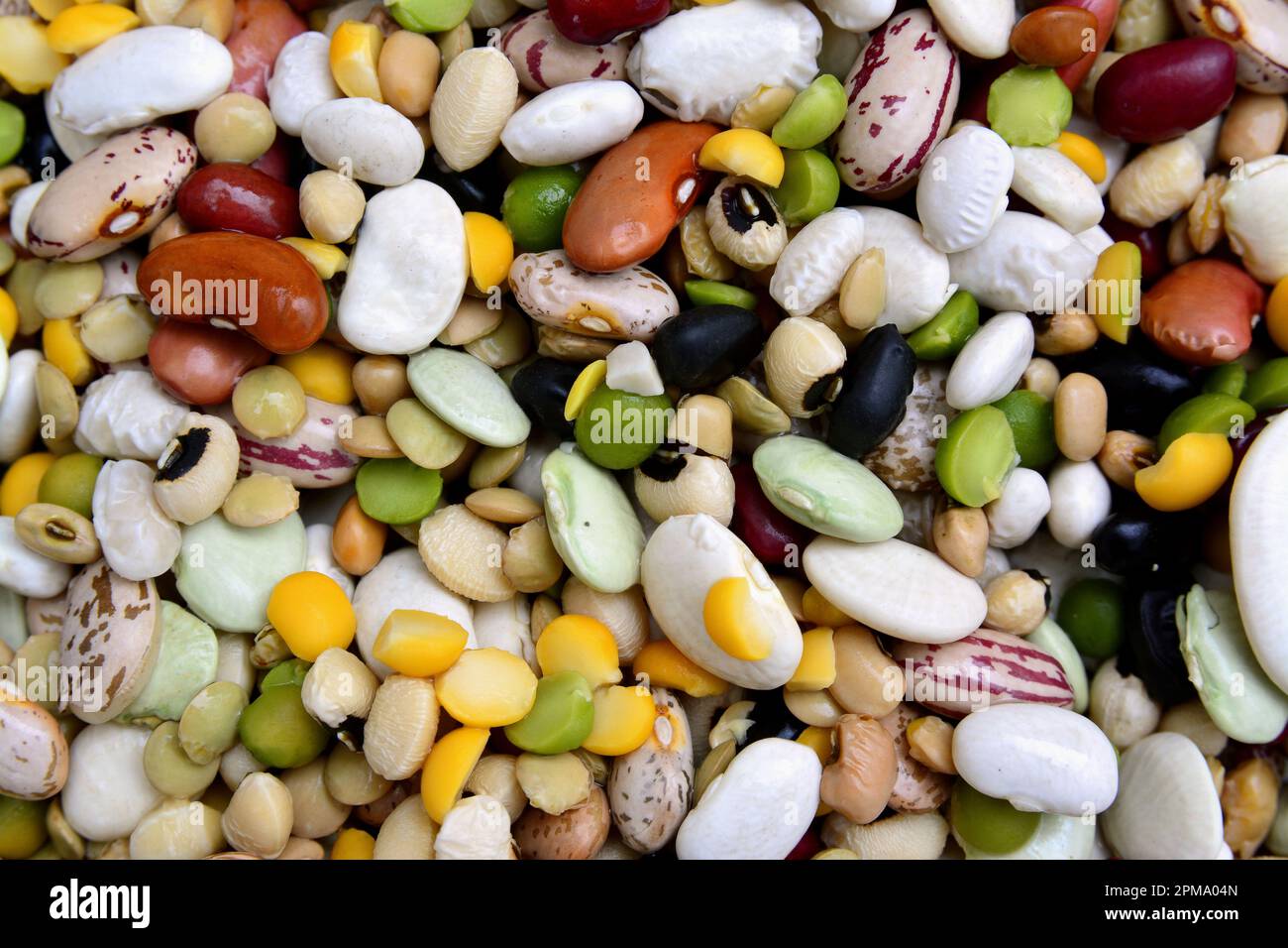 Washed assorted colorful beans for a soup Stock Photo - Alamy