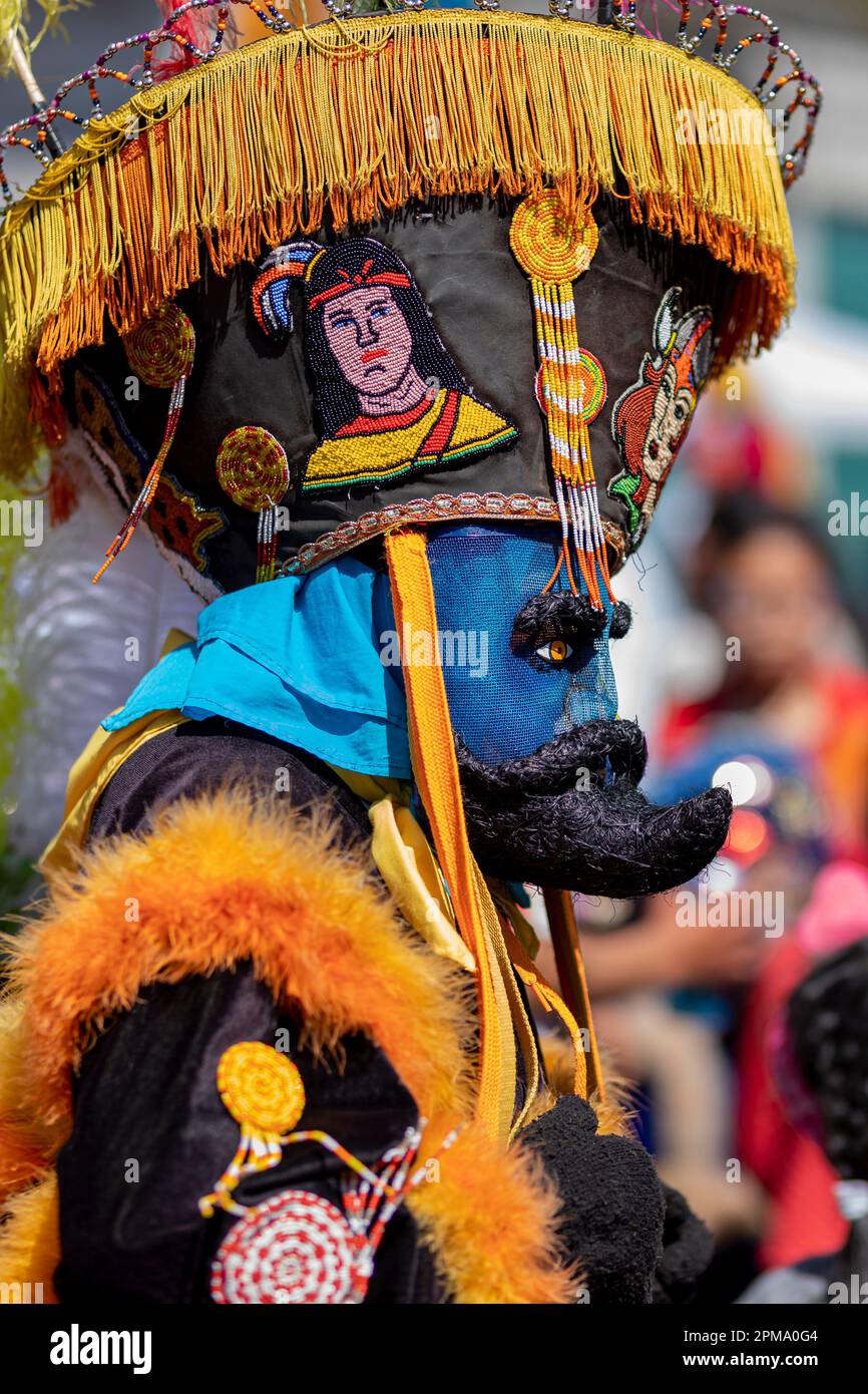 A person with a colorful chinelo costume, dancing in a carnival in ...