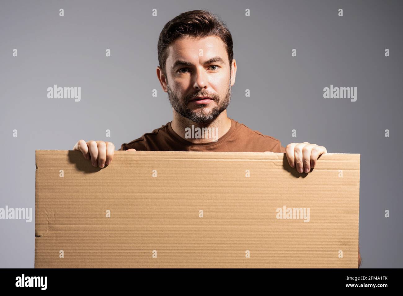 Information concept. Man with blank placard. Demonstrating copy space ...