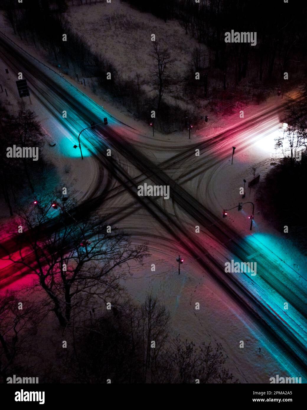 An aerial view of an intersection with red and green traffic lights on ...