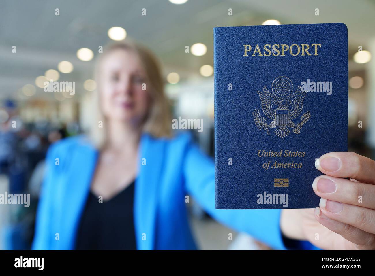 Woman showing passport of United States of America Stock Photo - Alamy