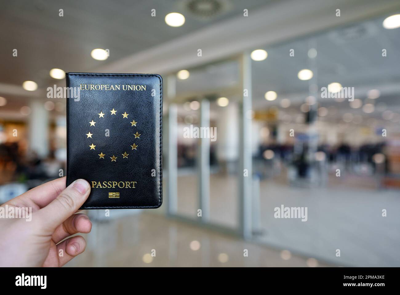 Man holding passport of European Union Stock Photo - Alamy