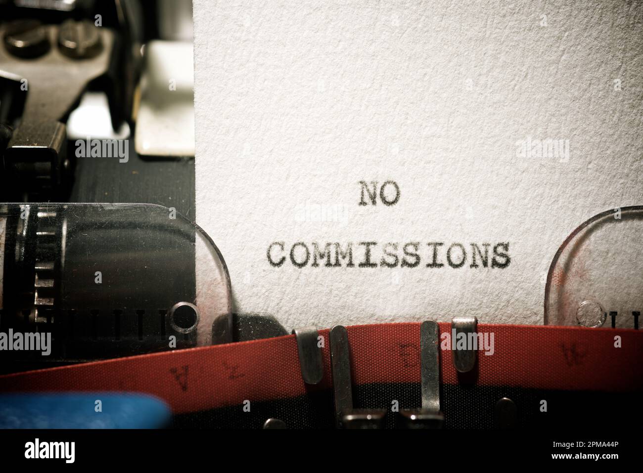 No commissions text written with a typewriter Stock Photo - Alamy