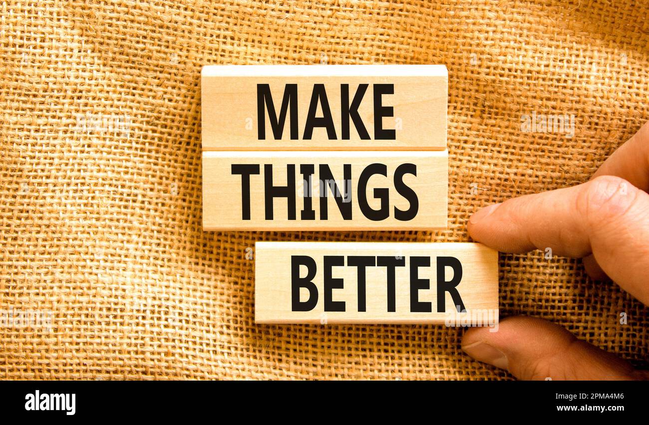Make things better symbol. Concept words Make things better on wooden block on a beautiful ...