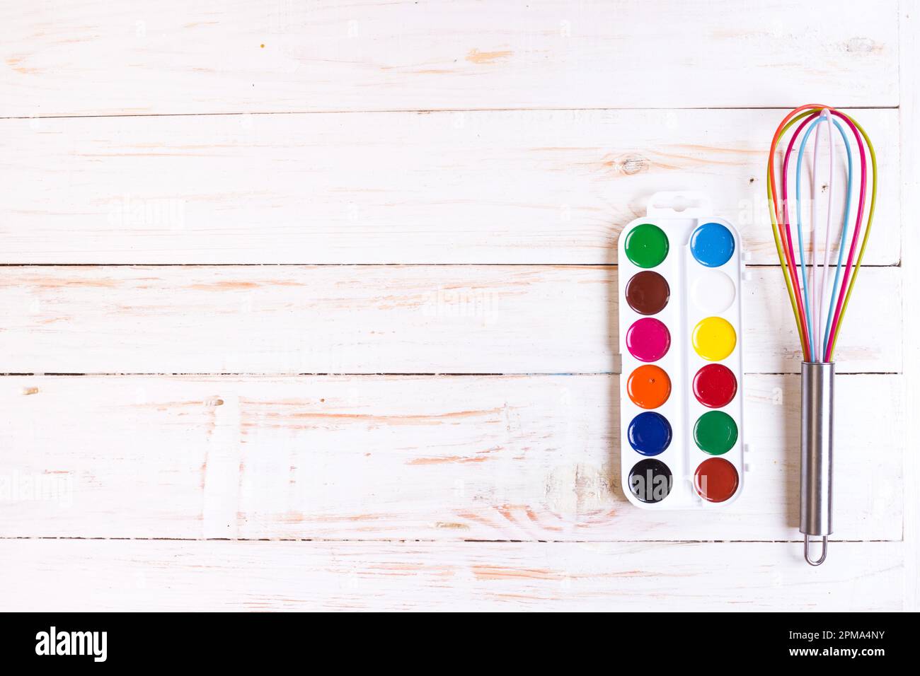 Watercolor paints and whisk. Concept of creativity. Desktop workplace ...