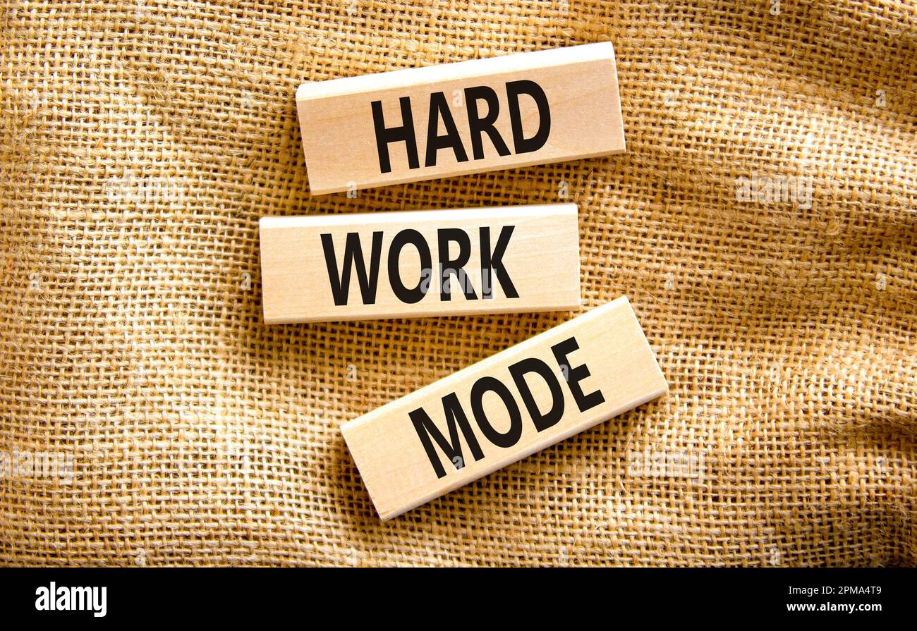 Hard work mode symbol. Concept words Hard work mode on wooden block on ...