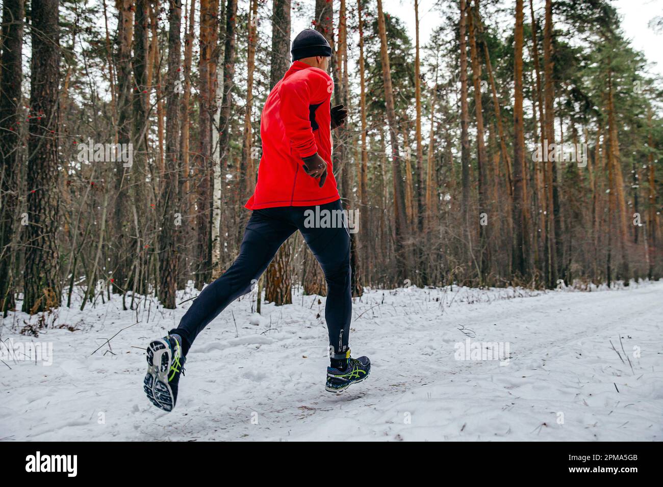 Ekaterinburg, Russia - November 26: male runner run winter trail race ...