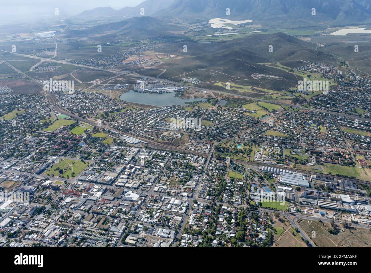 aerial landscape, from a glider, with downtown, railway, highway and ...