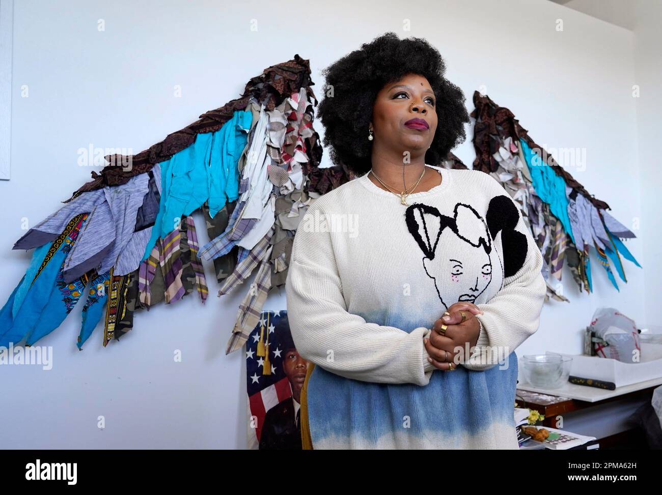 Artist Patrisse Cullors poses in front of her sculpture "A Prayer to ...