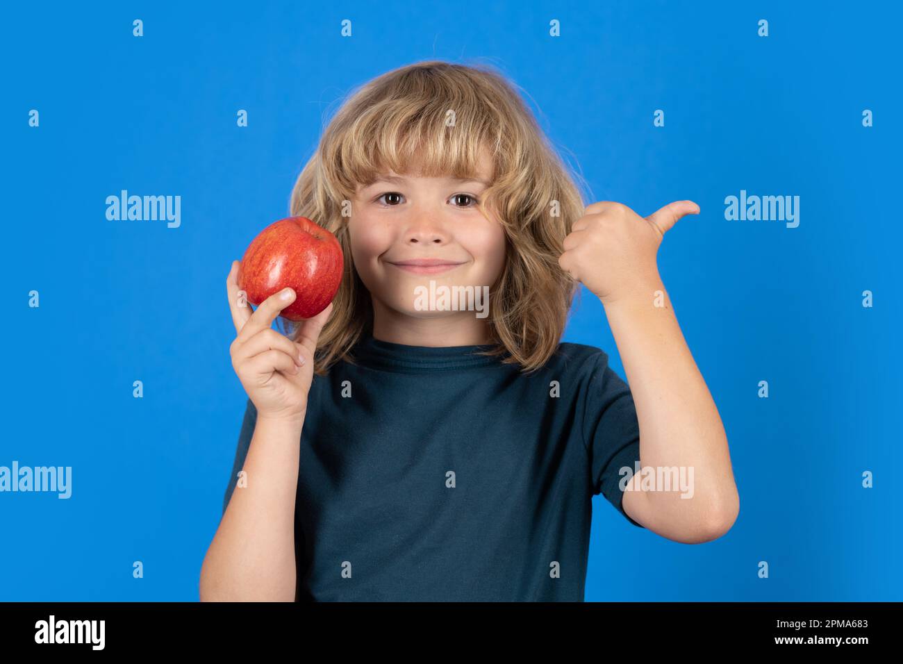 Healthy eating. Little cute kid boy with thumbs up hold red apple Stock ...