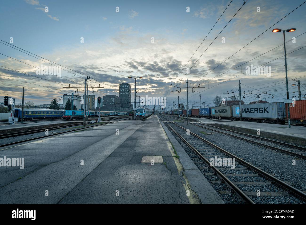 Passenger trains in station in cloudy spring morning in capital ...
