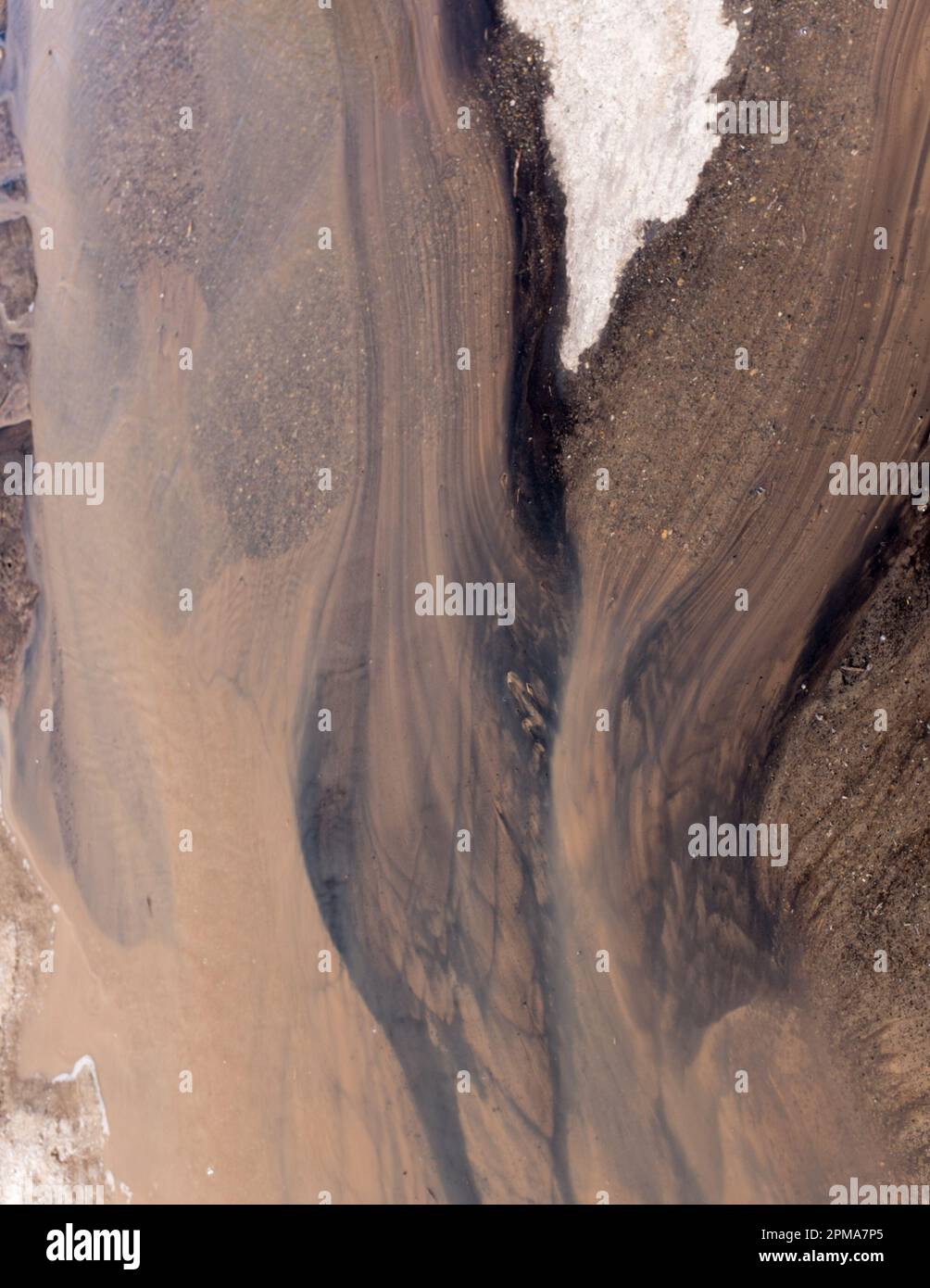 Spring melting creates interesting mud flows as gravity pulls the water ...