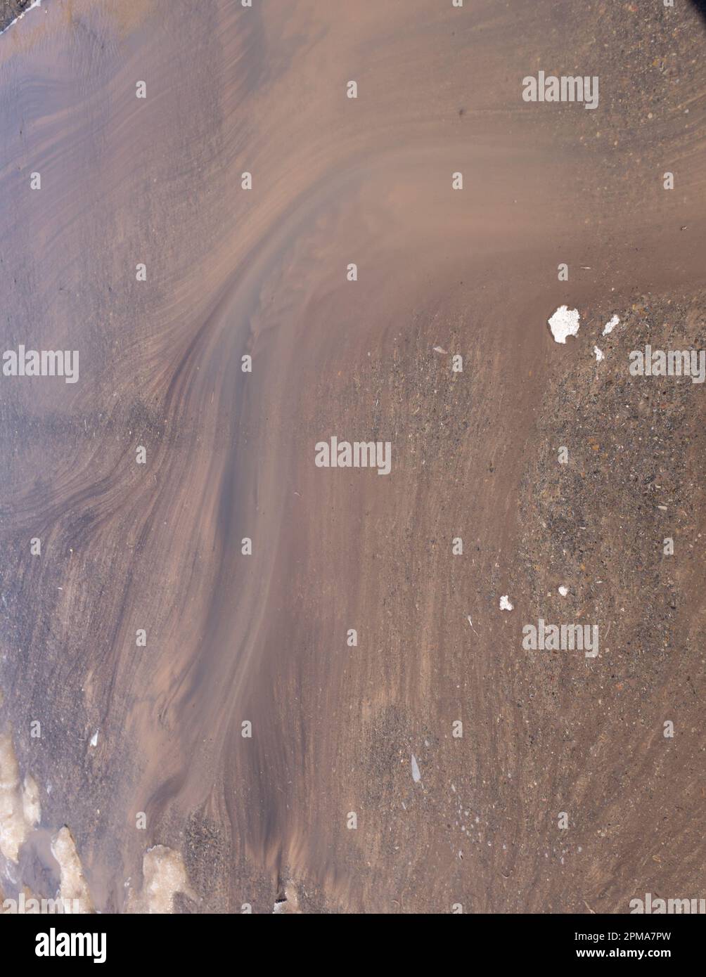 Spring melting creates interesting mud flows as gravity pulls the water ...