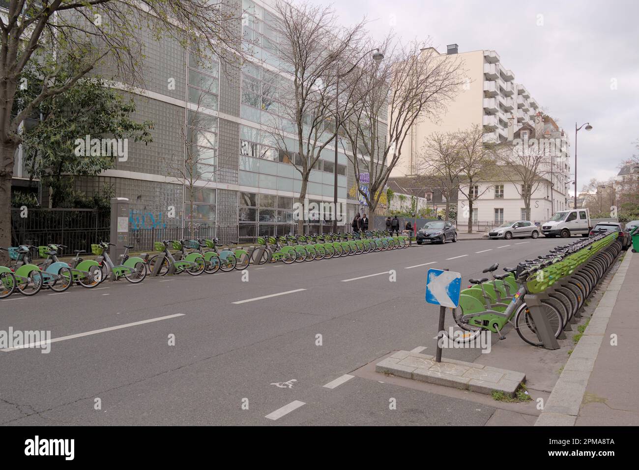Alignment of bicycles in Velib stations in a Paris street Stock Photo ...