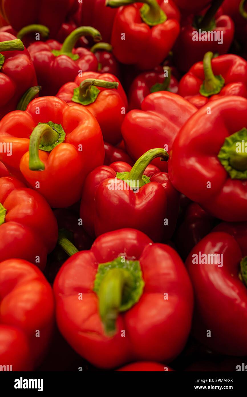 Big pile of red peppers in a store Stock Photo - Alamy