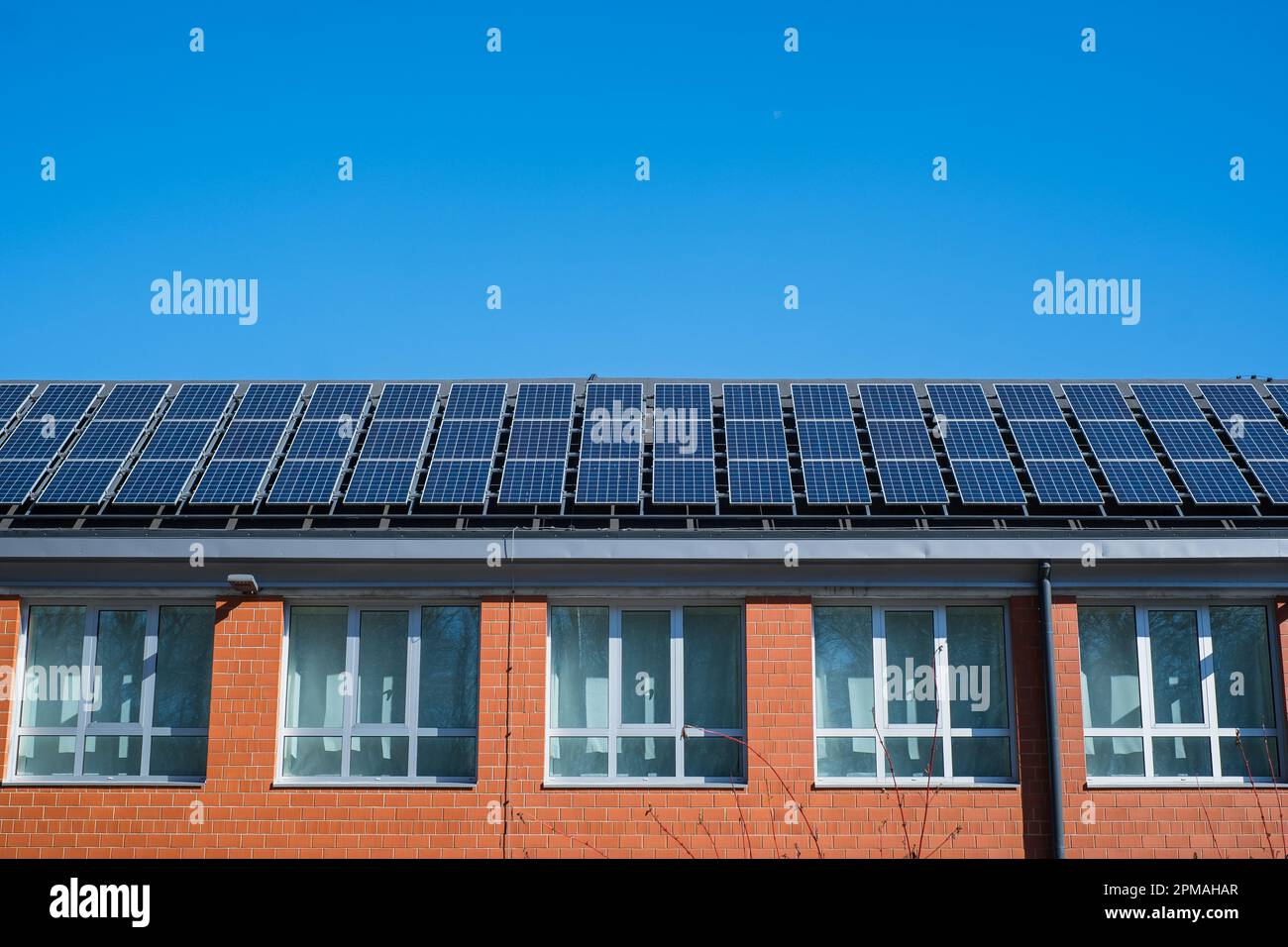 Close-up of solar panels installed on large building roof Stock Photo ...