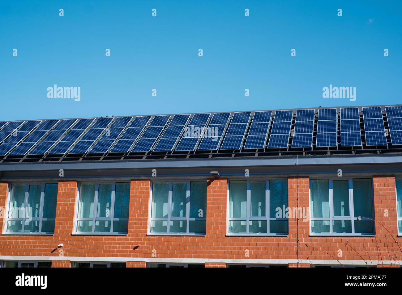 Close-up of solar panels installed on large building roof Stock Photo ...