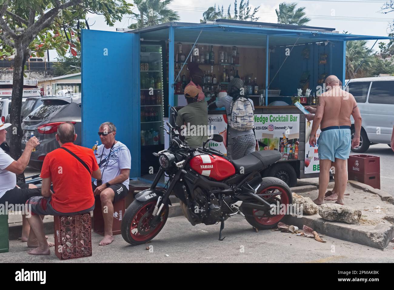 Beachgoers buy soft drinks at the kiosk, Barbados, Caribbean Stock ...