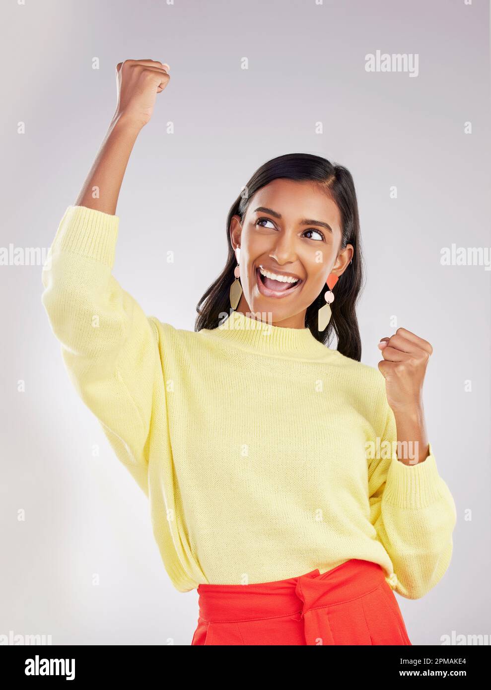 Winner, happy and celebration with a woman on a white background in ...