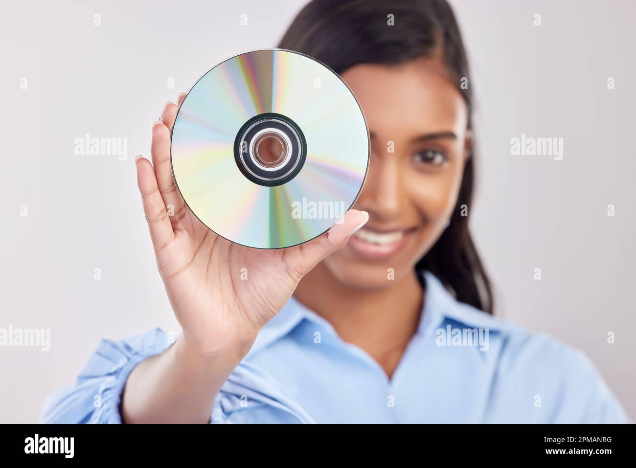 Portrait, happy and woman with cd, excited and technology against a ...