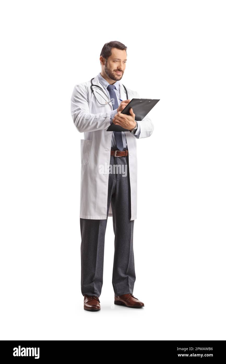 Full length shot of a male doctor standing and writing a document ...
