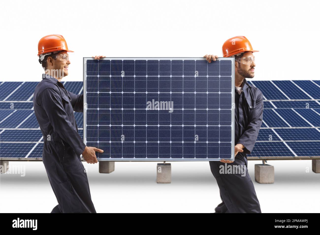 Workers in uniforms carrying a solar panel at a photovoltaic field ...