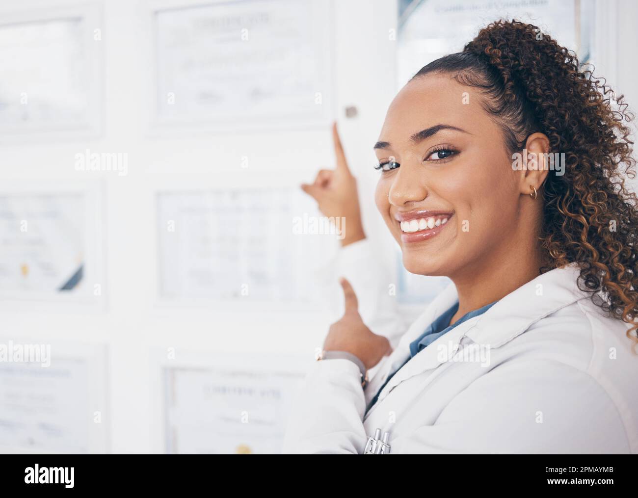 Portrait, pointing and healthcare award with a woman proud of her ...