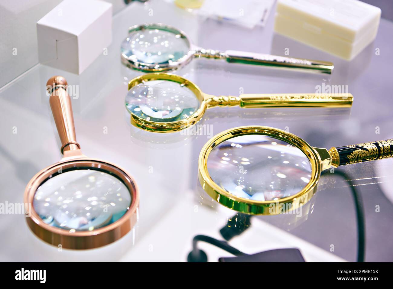 Magnifiers with handles in optical store Stock Photo - Alamy