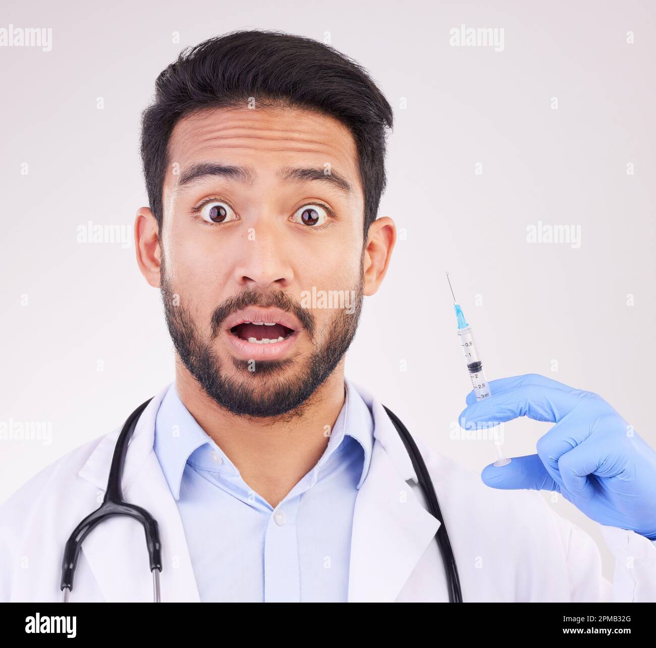 Wow, portrait and doctor with vaccine, syringe and surprise in studio ...