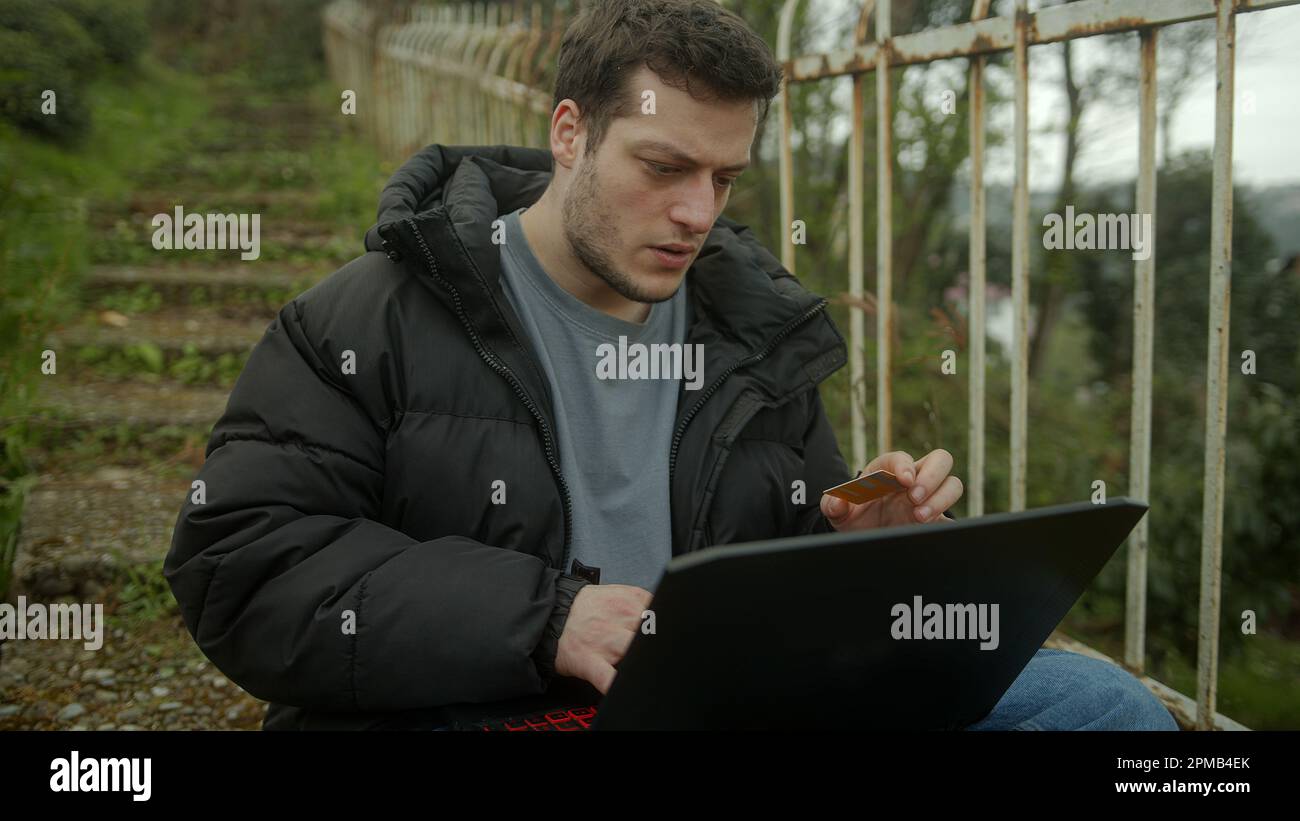 Seriously Man outside checking his credit card on the laptop went mad ...
