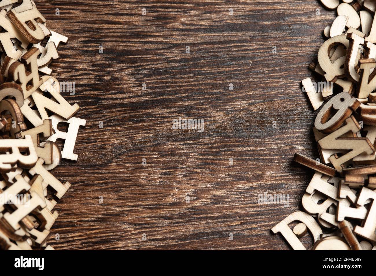Scattered Random Wood Characters Bordering Image Edge Stock Photo - Alamy