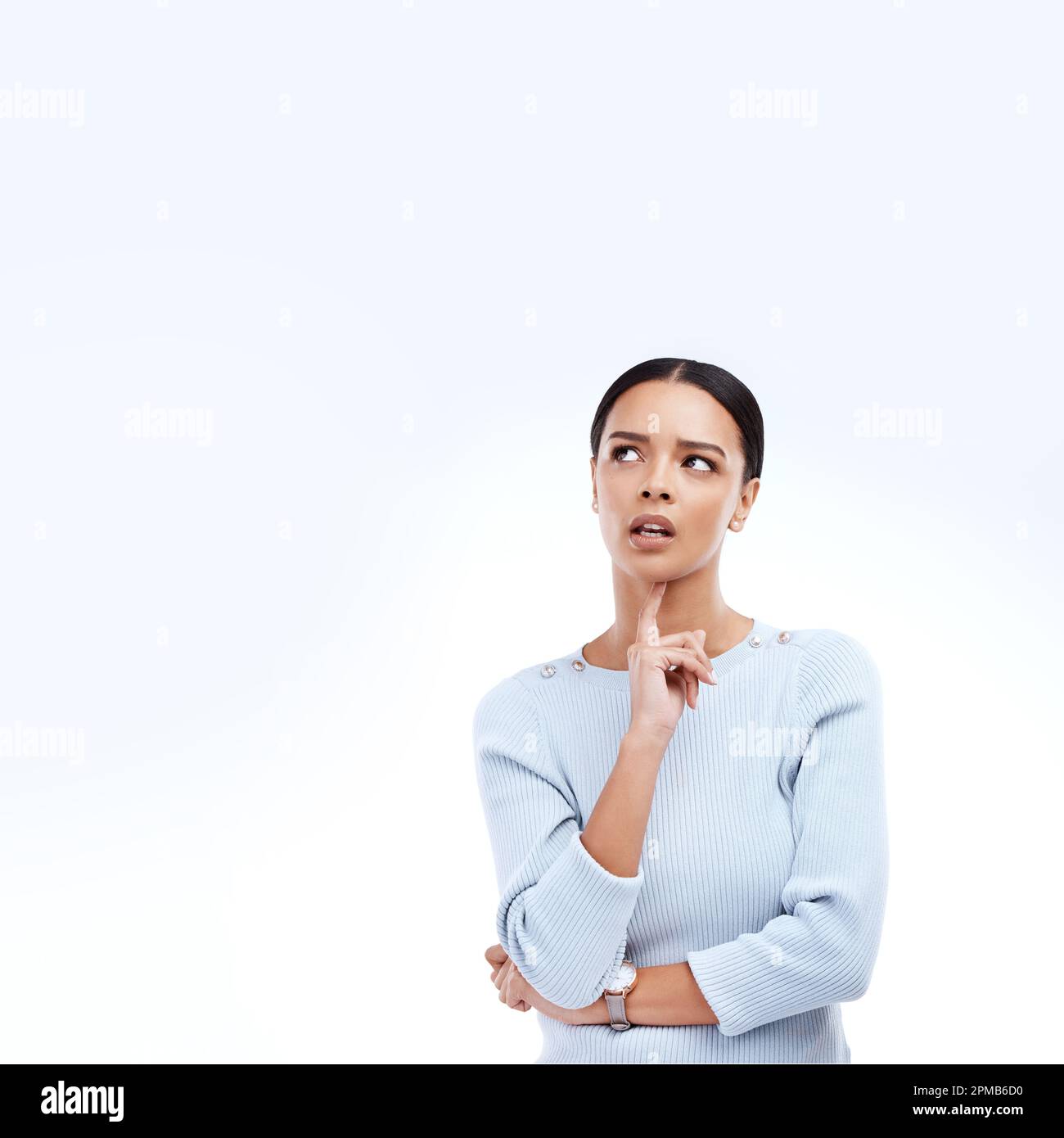 Thinking, confused and face of woman with doubt in studio for decision ...