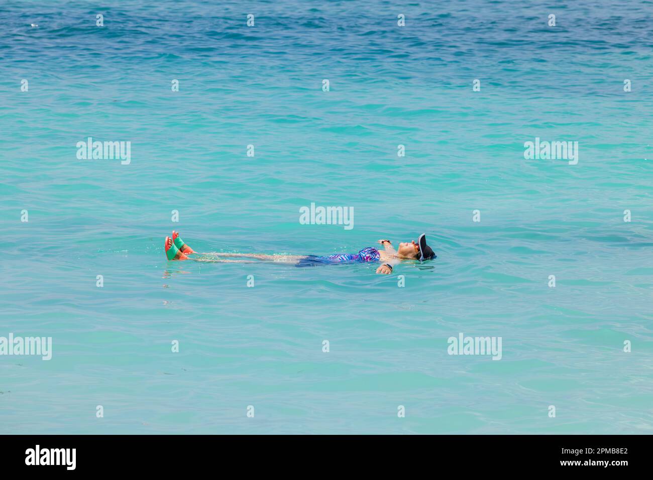 Beautiful woman laying on beach hi-res stock photography and images - Alamy
