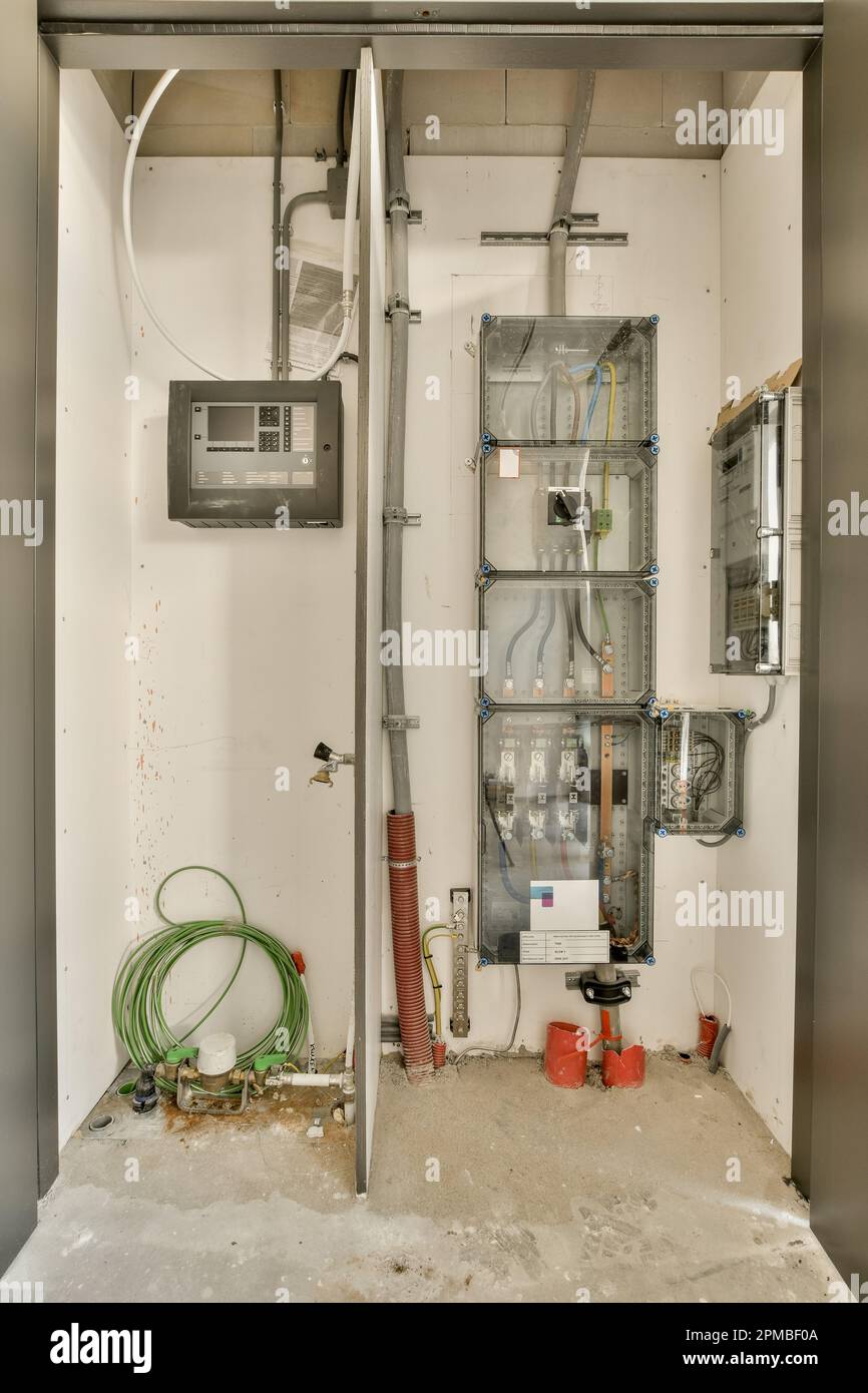 the inside of a building with pipes and electrical equipment on the ...