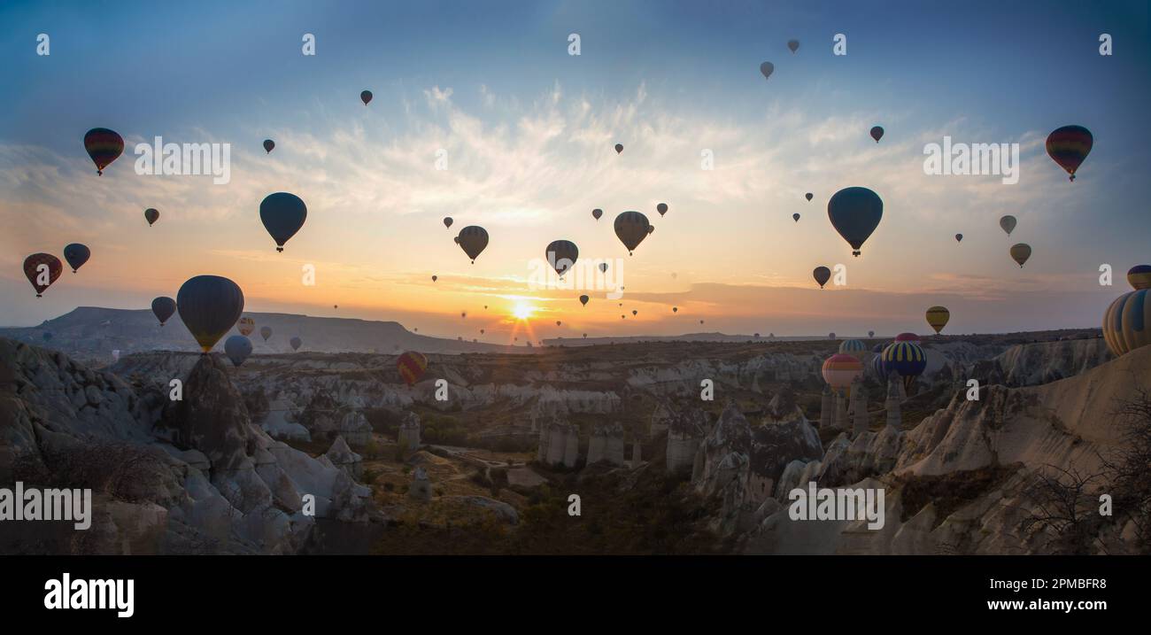 Balloons at dawn in the landscape of cappadocia Stock Photo - Alamy