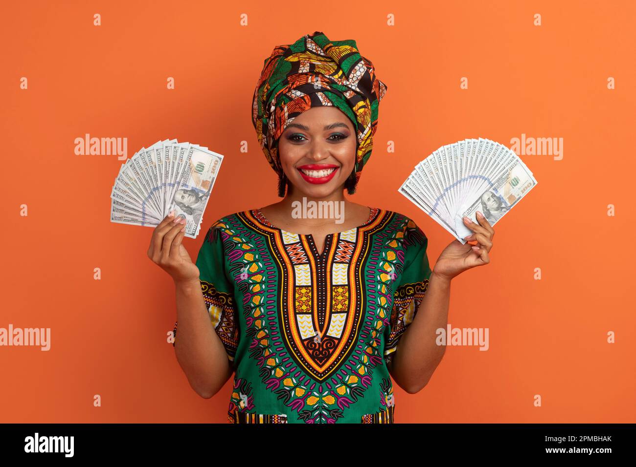 Happy black woman won big prize, holding cash and smiling Stock Photo ...