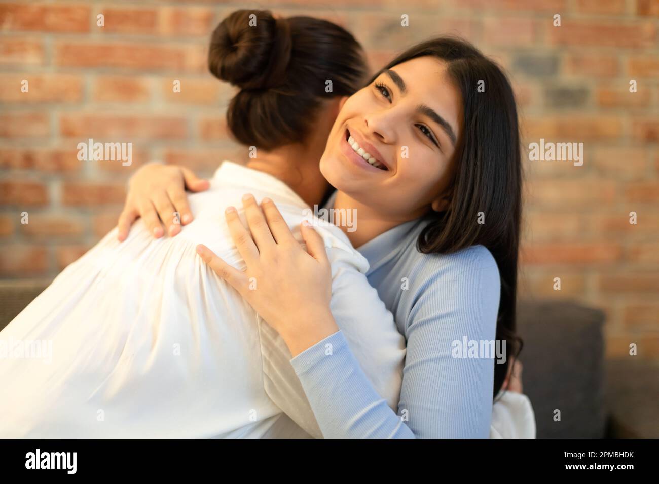 Best friends embracing, satisfied lady enjoying tender moment missed ...